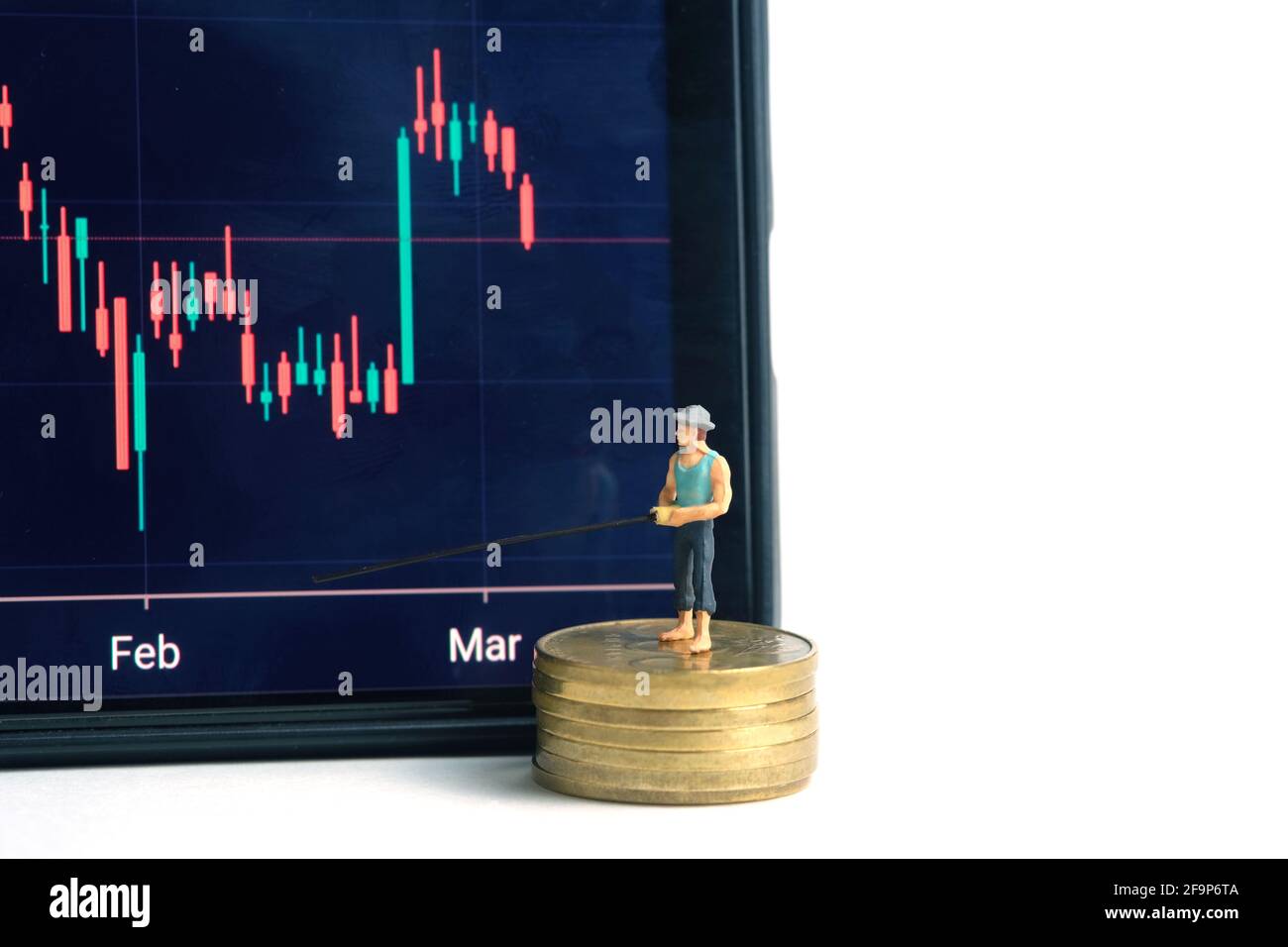 Miniature people toy photography. An angler standing above coin money ...