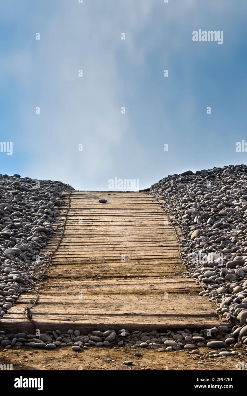 Boardwalk pathway to a sandy beach in summer with blue sky Stock Photo ...