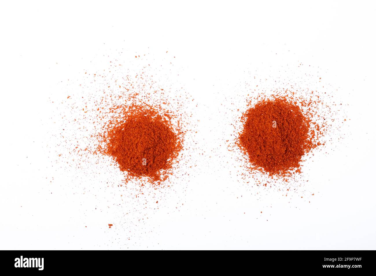 Pile of red paprika powder isolated on white background and texture ...