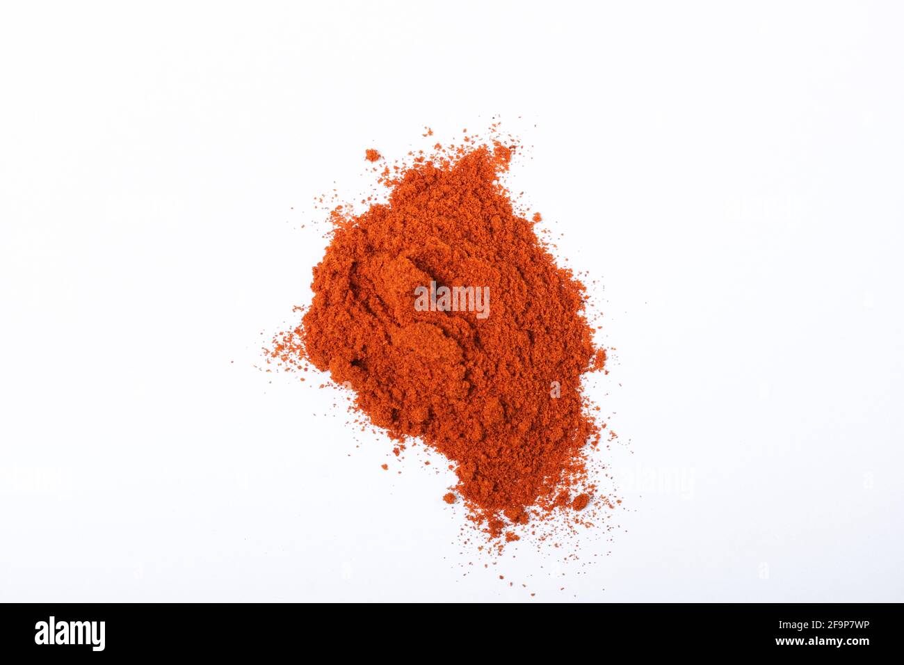 Pile of red paprika powder isolated on white background and texture ...
