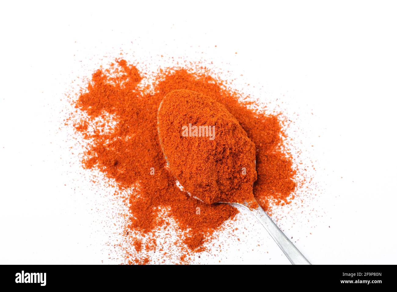 Pile of red paprika powder isolated on white background and texture ...