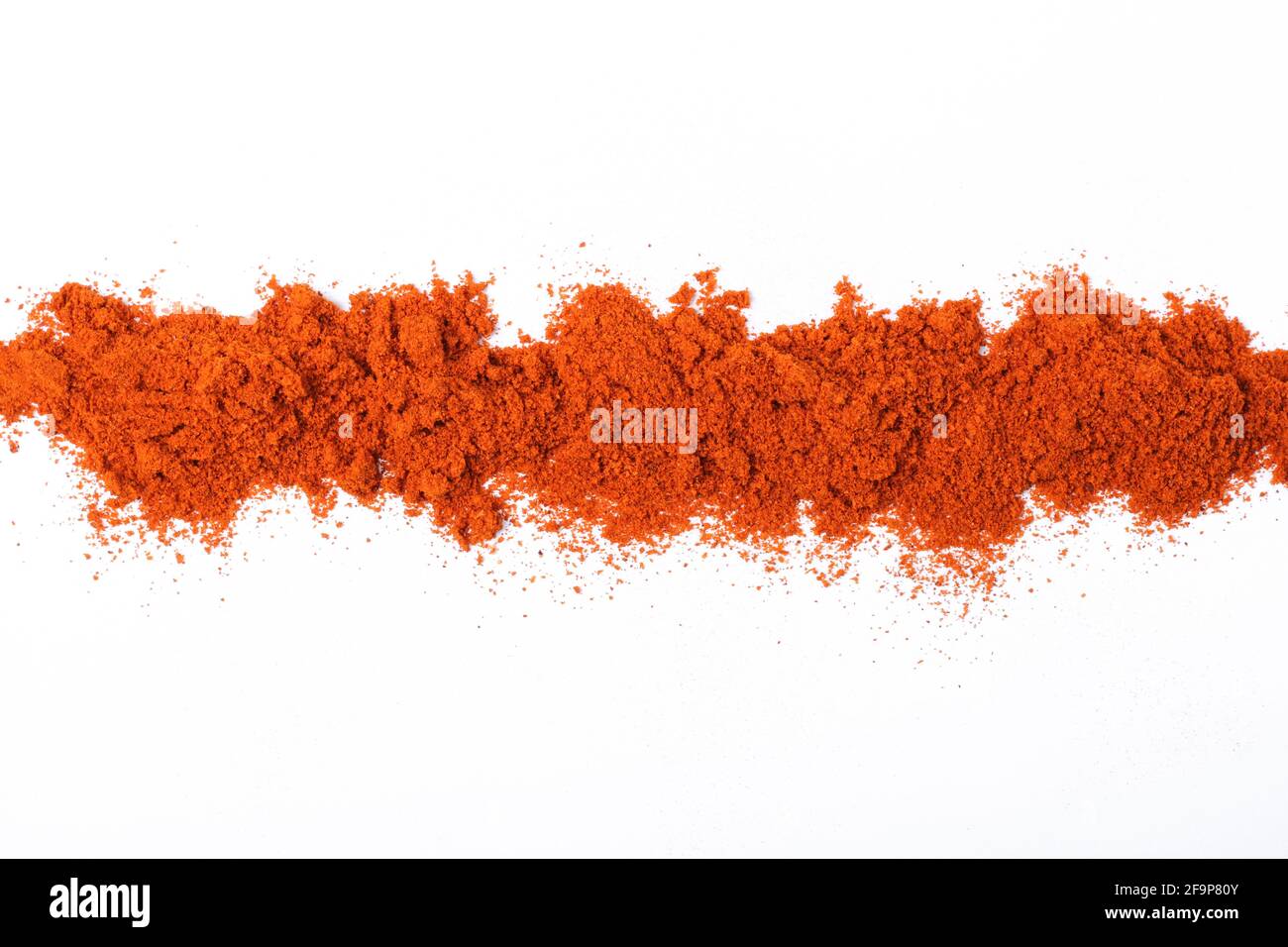 Pile of red paprika powder isolated on white background and texture ...
