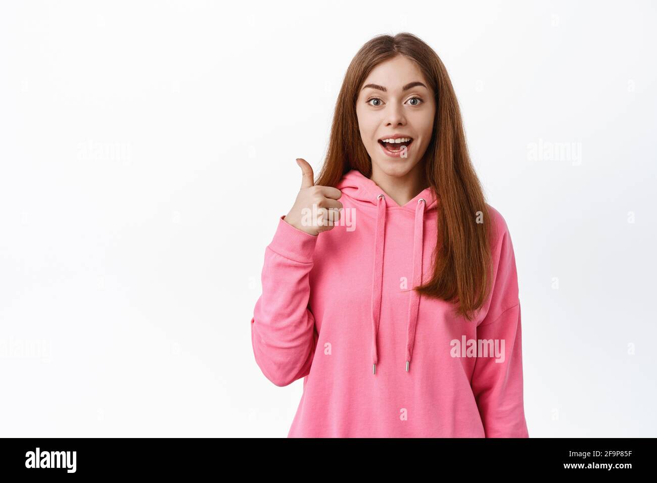 Sounds good. Smiling young woman say yes, agree with you, praise good ...