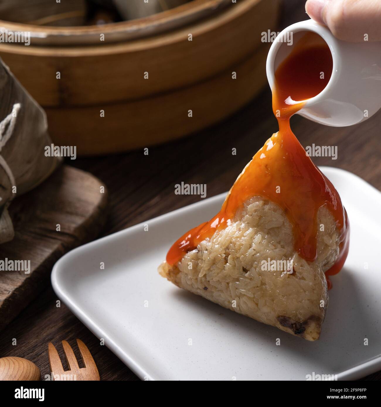 Eating Zongzi rice dumpling for Chinese traditional Dragon Boat ...