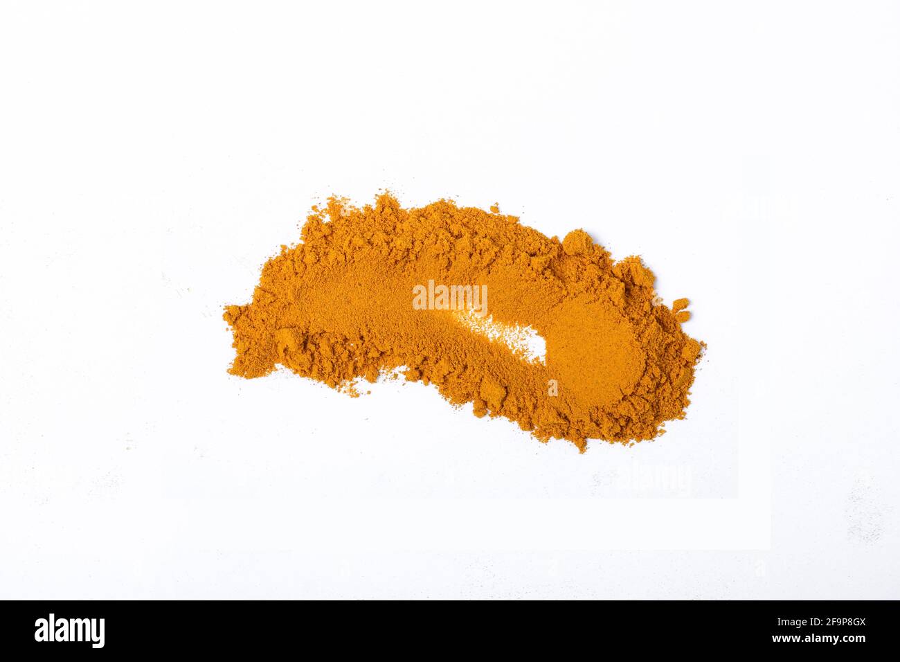 Turmeric powder on black background Stock Photo - Alamy