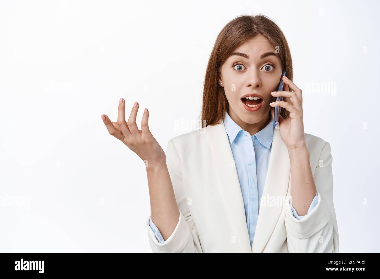 Surprised office woman ceo answer phone call, look amazed with ...