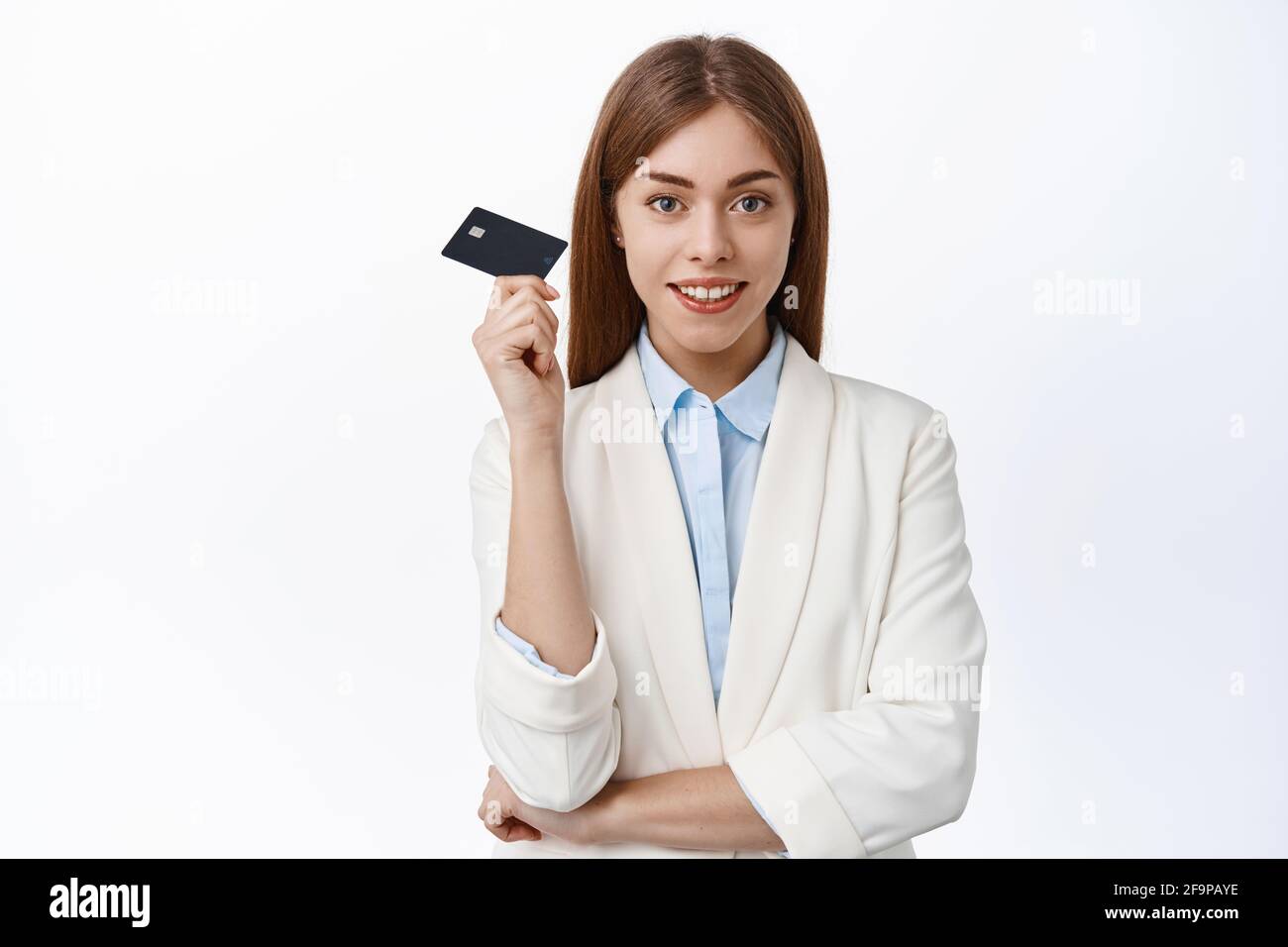 Confident professional ceo office woman shows plastic credit card ...