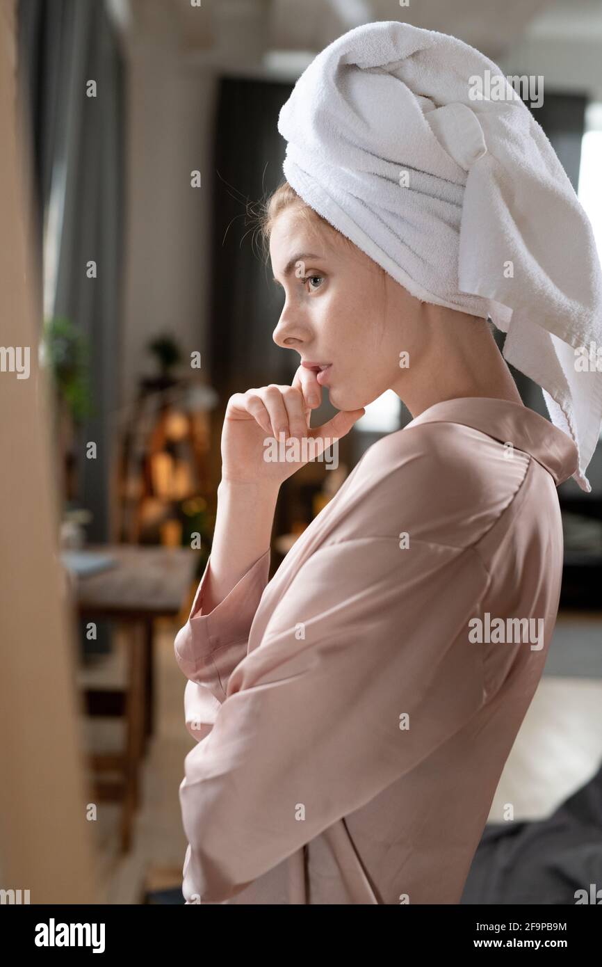 Young woman in dressing gown making morning preparation at home Stock ...