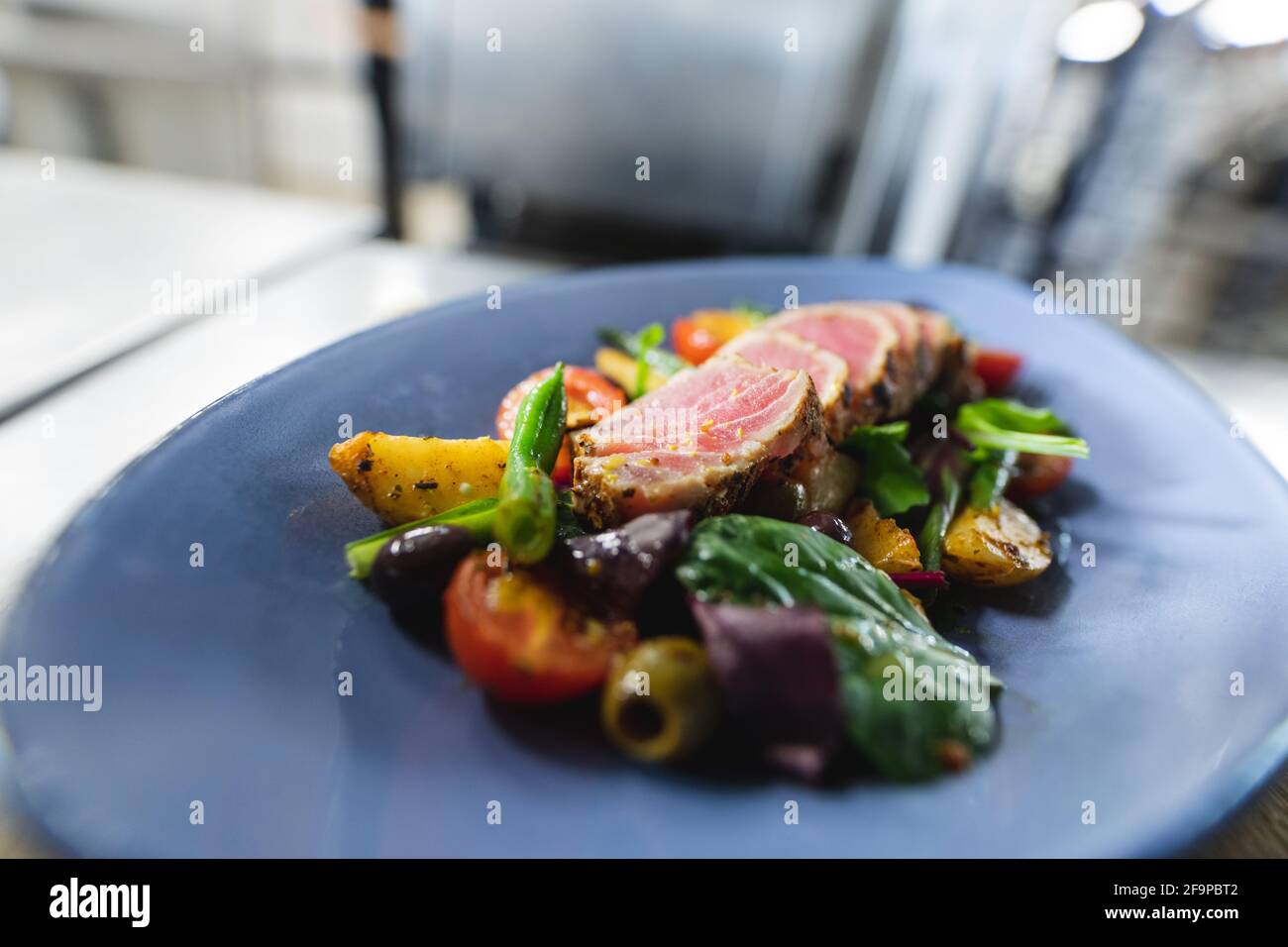 Close up of ready to serve dish prepared by professional chef. working ...