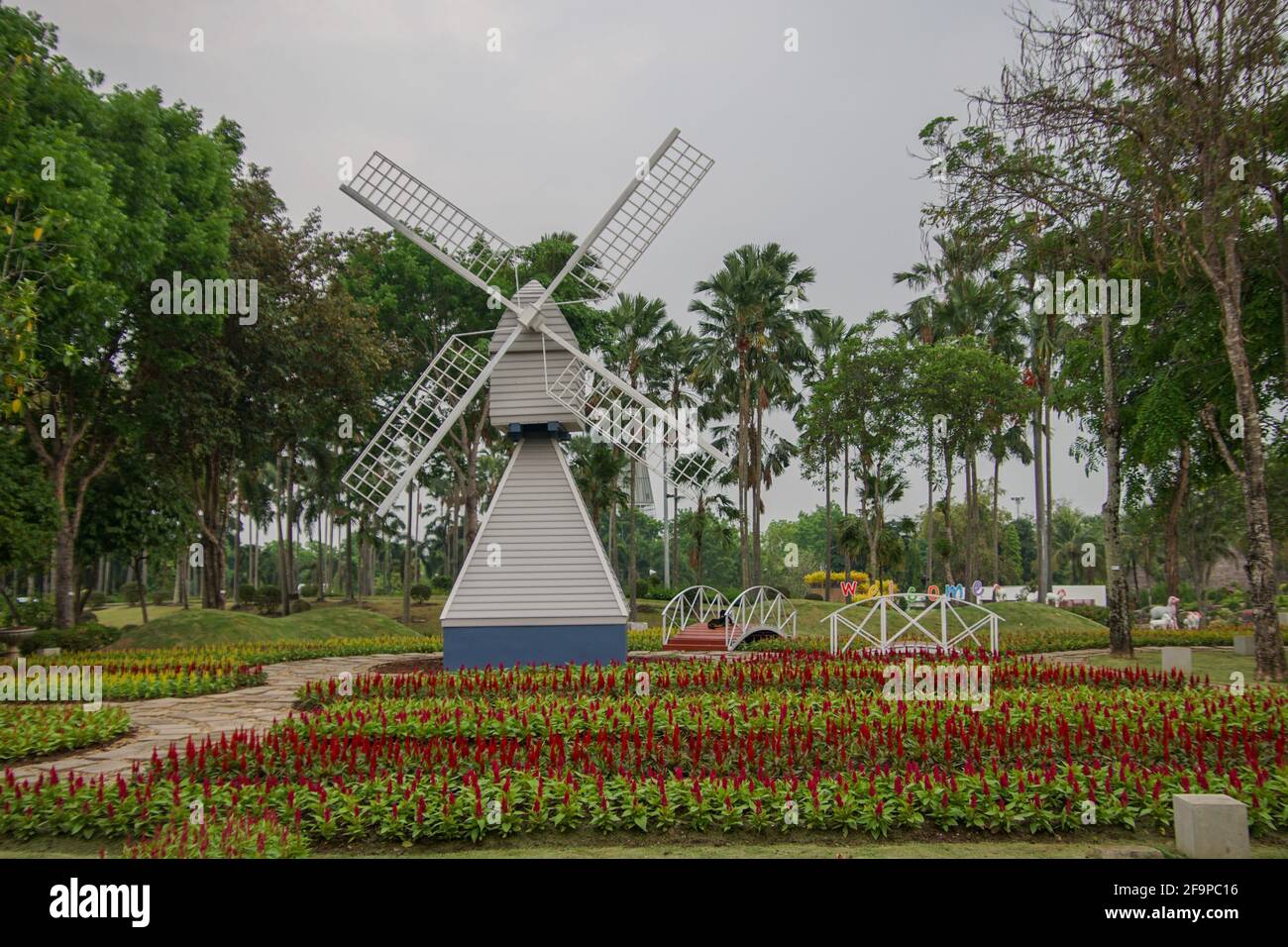Scenic view of a classic vintage windmill in a park Stock Photo - Alamy