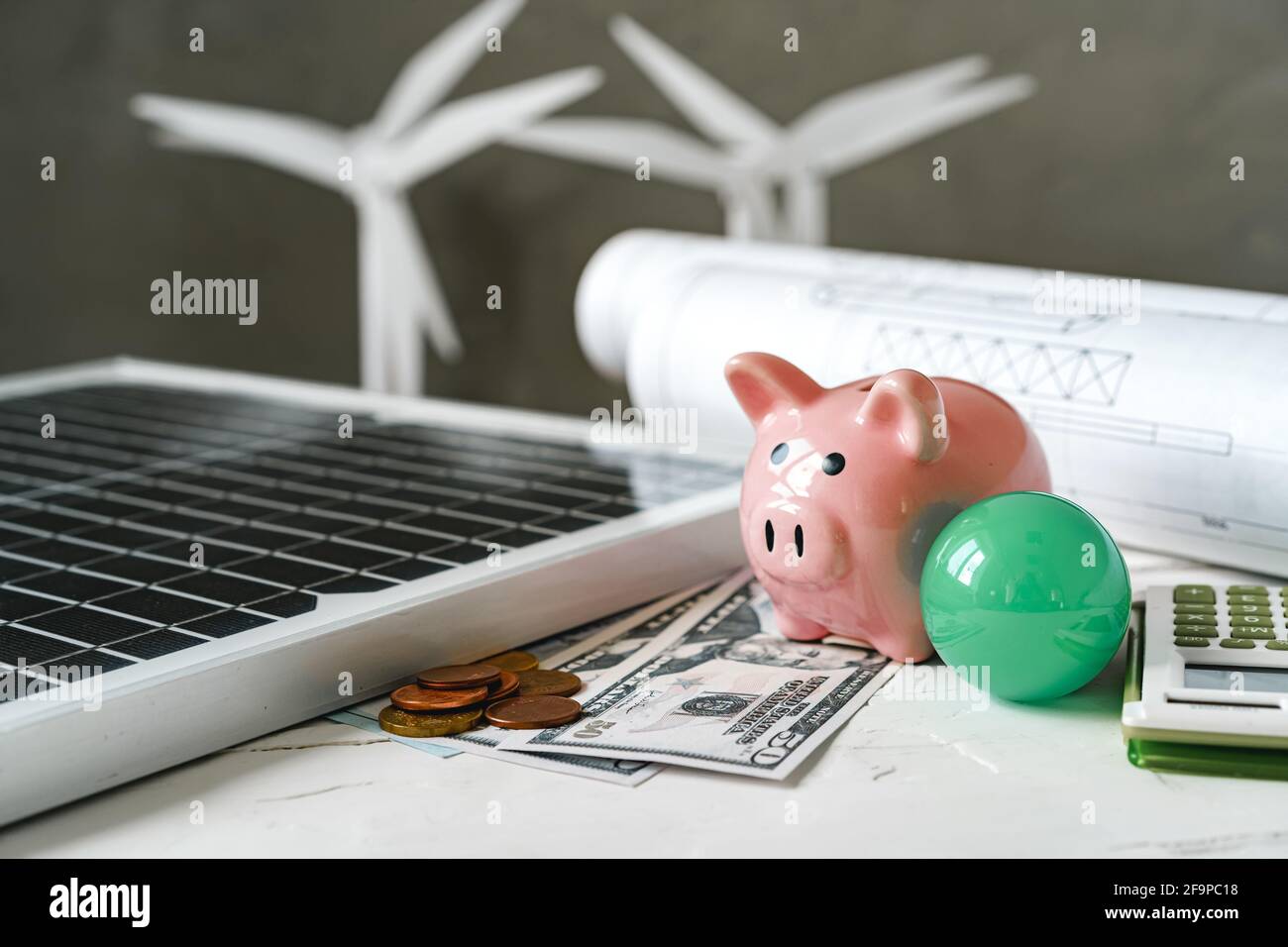 Models of windmill and solar panel, alternative energy sources Stock ...