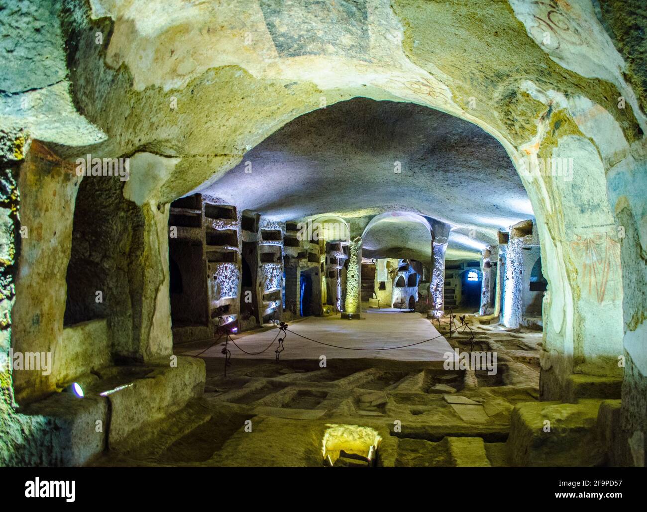 view of interior of famous tourist attraction in naples - catacombs of ...
