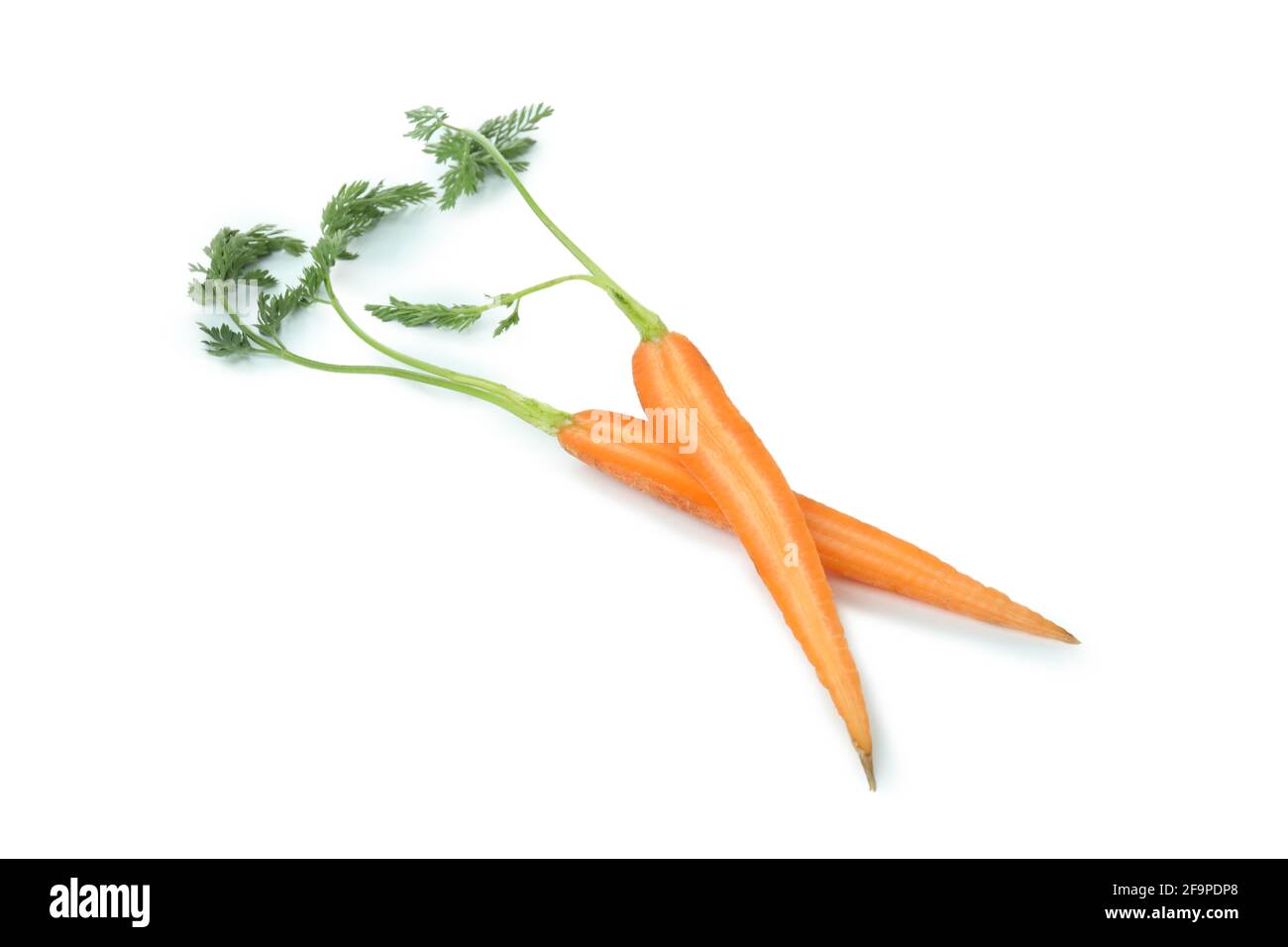 Fresh carrot halves isolated on white background Stock Photo - Alamy