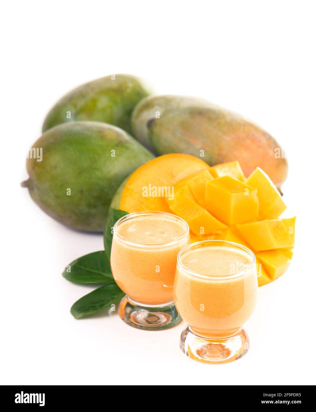 mango fruit and leaves isolated on white background Stock Photo - Alamy