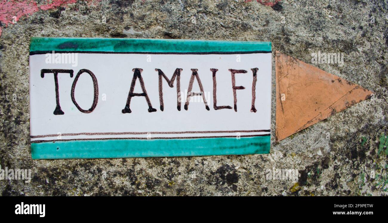 trail sign showing way to amalfi town in italy Stock Photo - Alamy