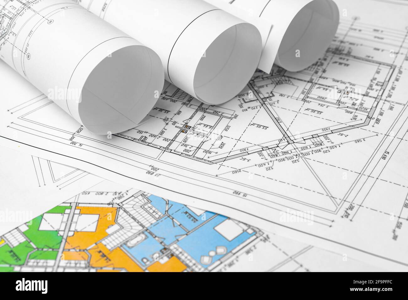 Architectural construction plans paper on table close up Stock Photo ...