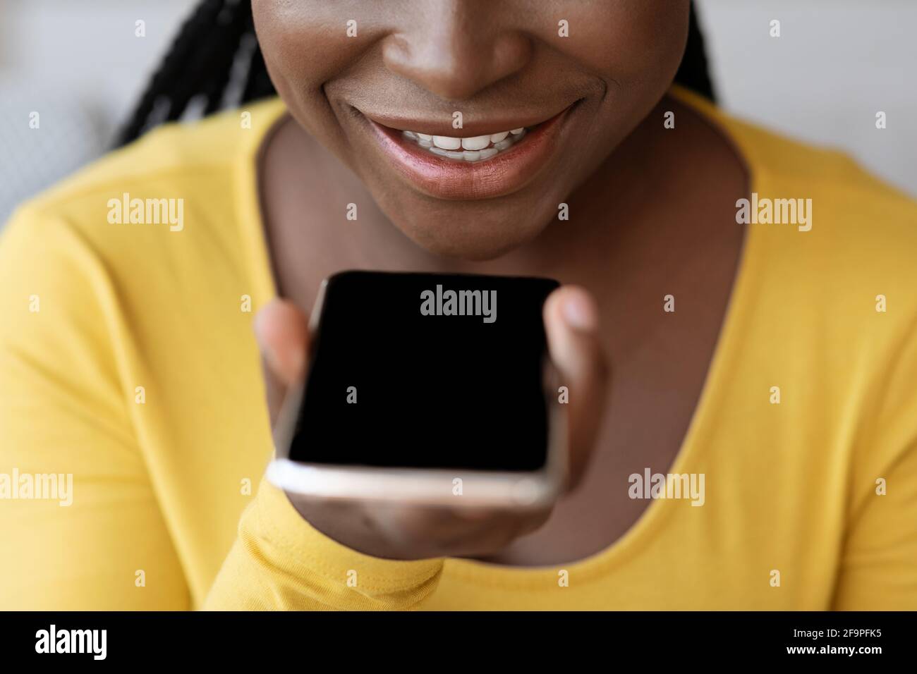 Voice Search Concept. Black woman using personal assistant app on ...