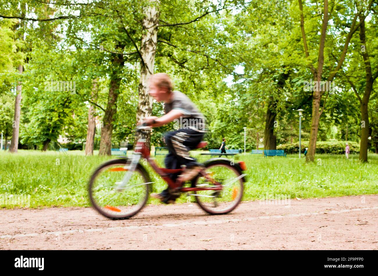 Boy riding his bicycle hi-res stock photography and images - Alamy