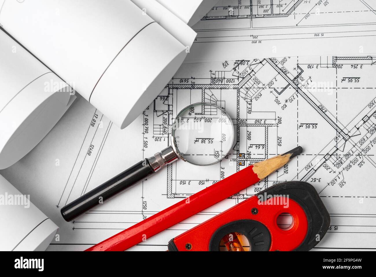 Architectural construction plans paper on table close up Stock Photo ...