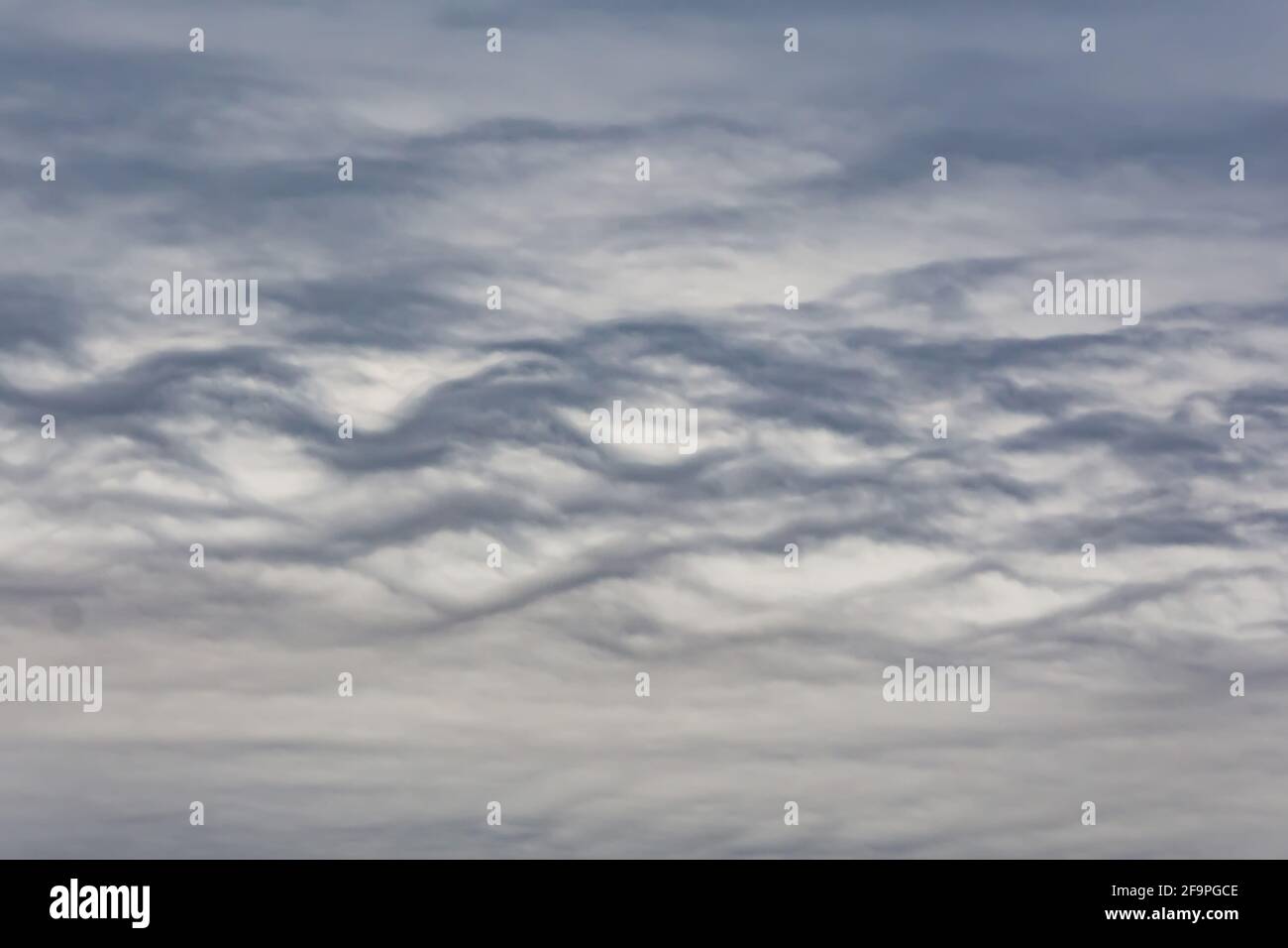 Gray wavy clouds bad weather, cold snap, passing of a cold atmospheric ...