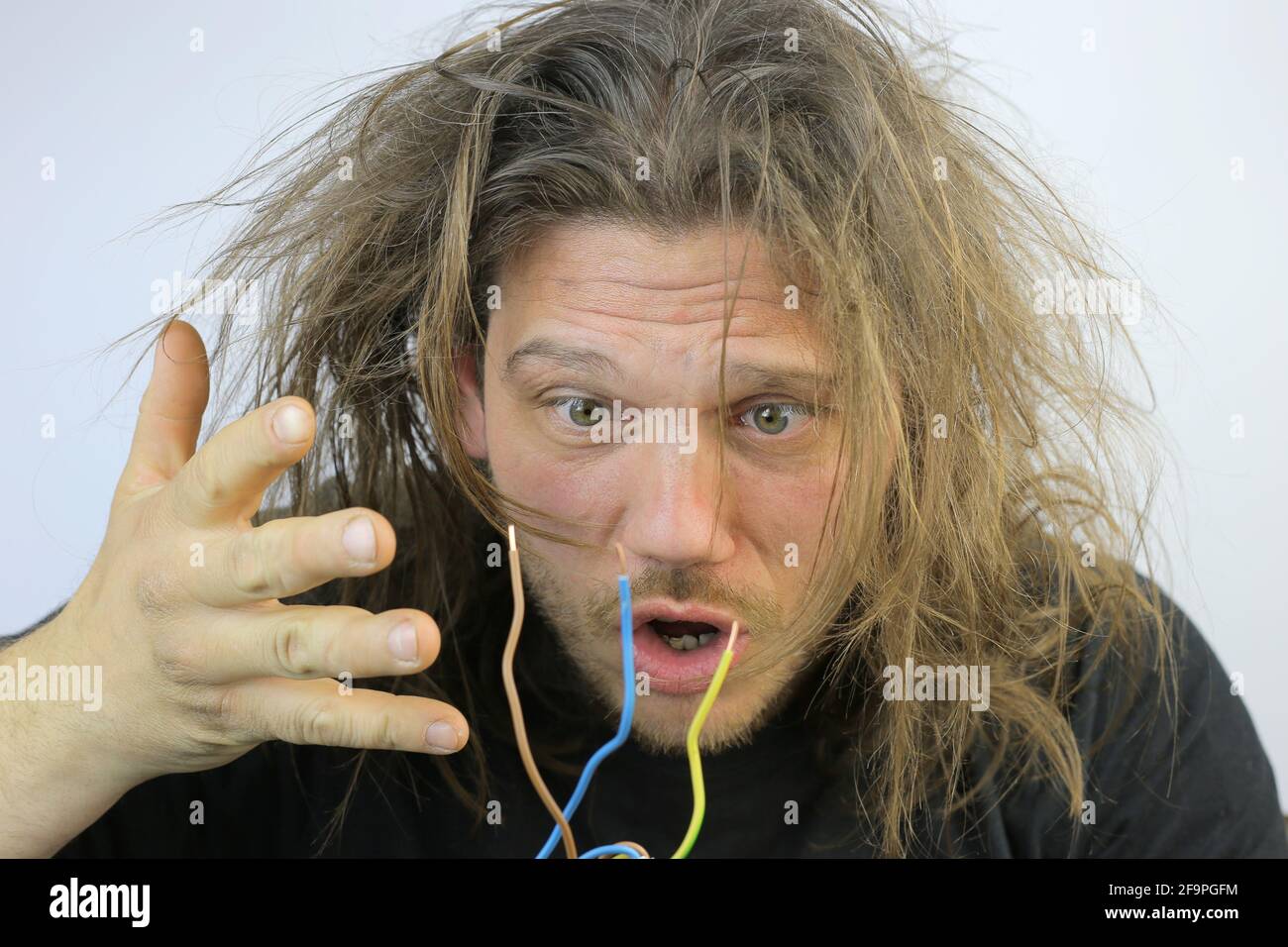 Man getting electric shock hi-res stock photography and images - Alamy