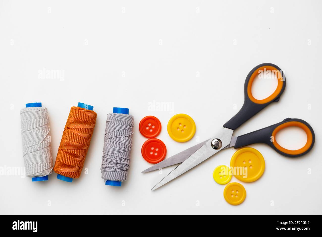 Various sewing accessories isolated on white background Stock Photo - Alamy