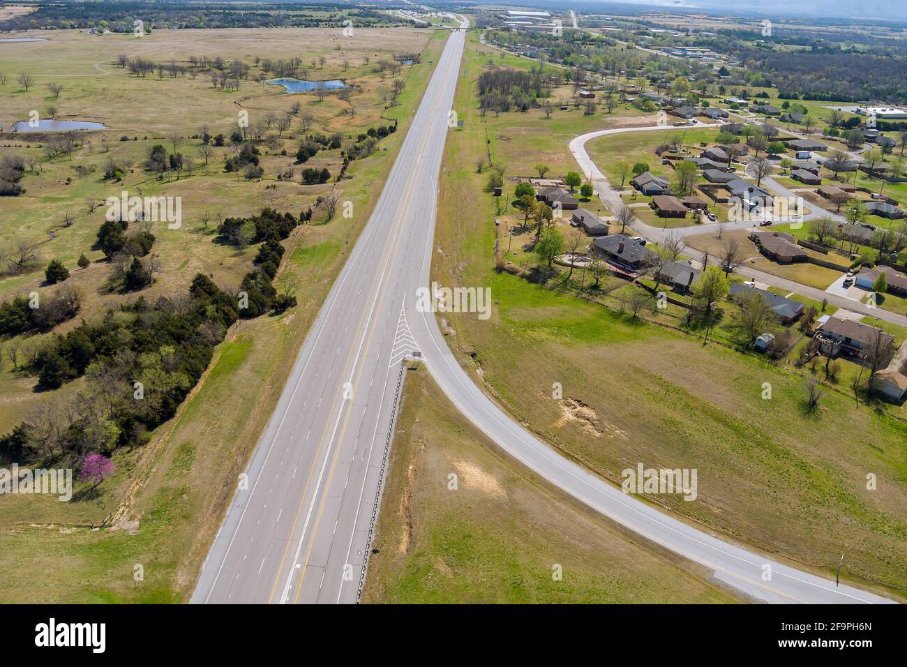 Aerial view road highway near a small town in villages Stock Photo - Alamy