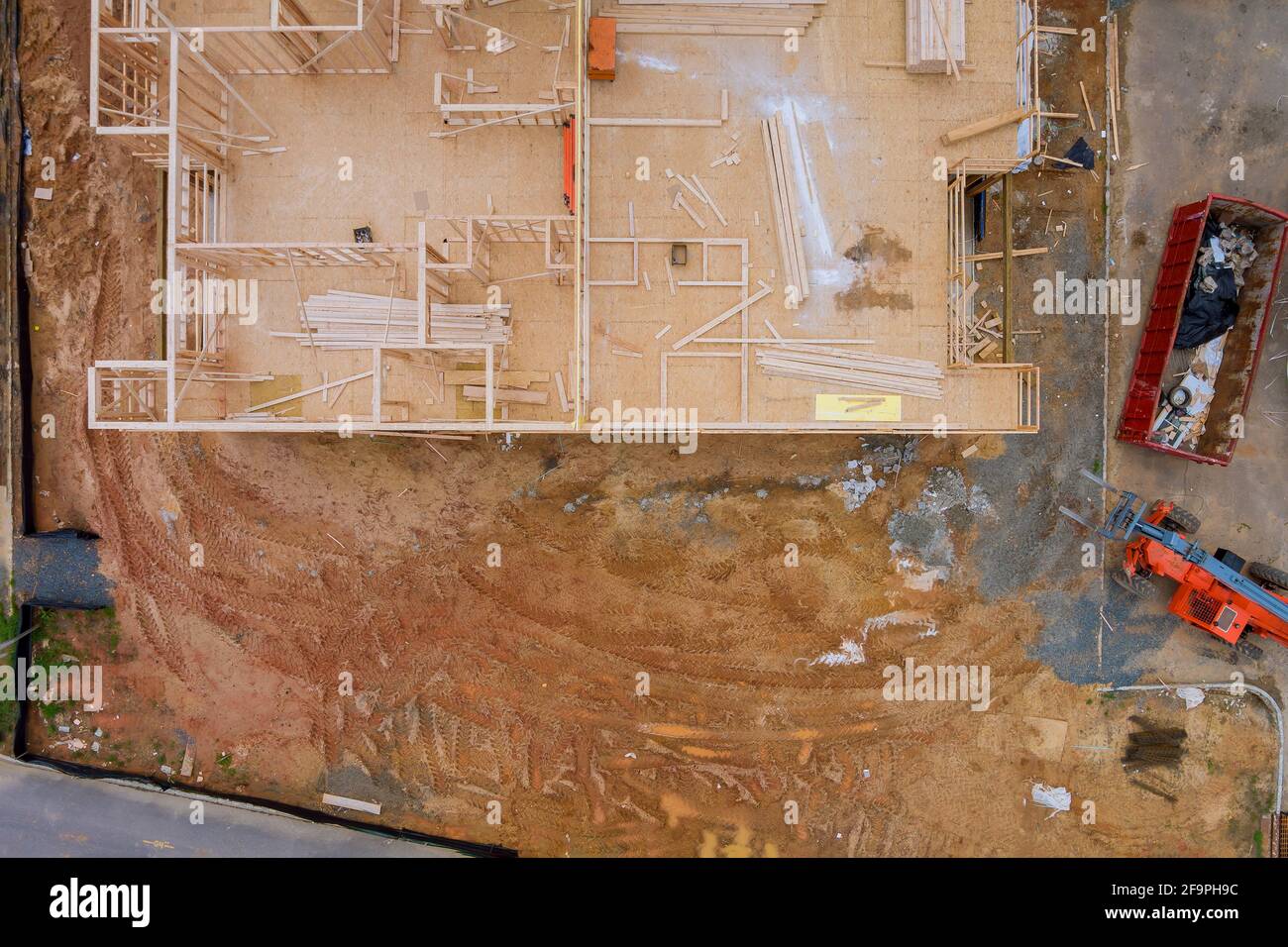 Aerial view of apartment framing of a new house under construction with ...