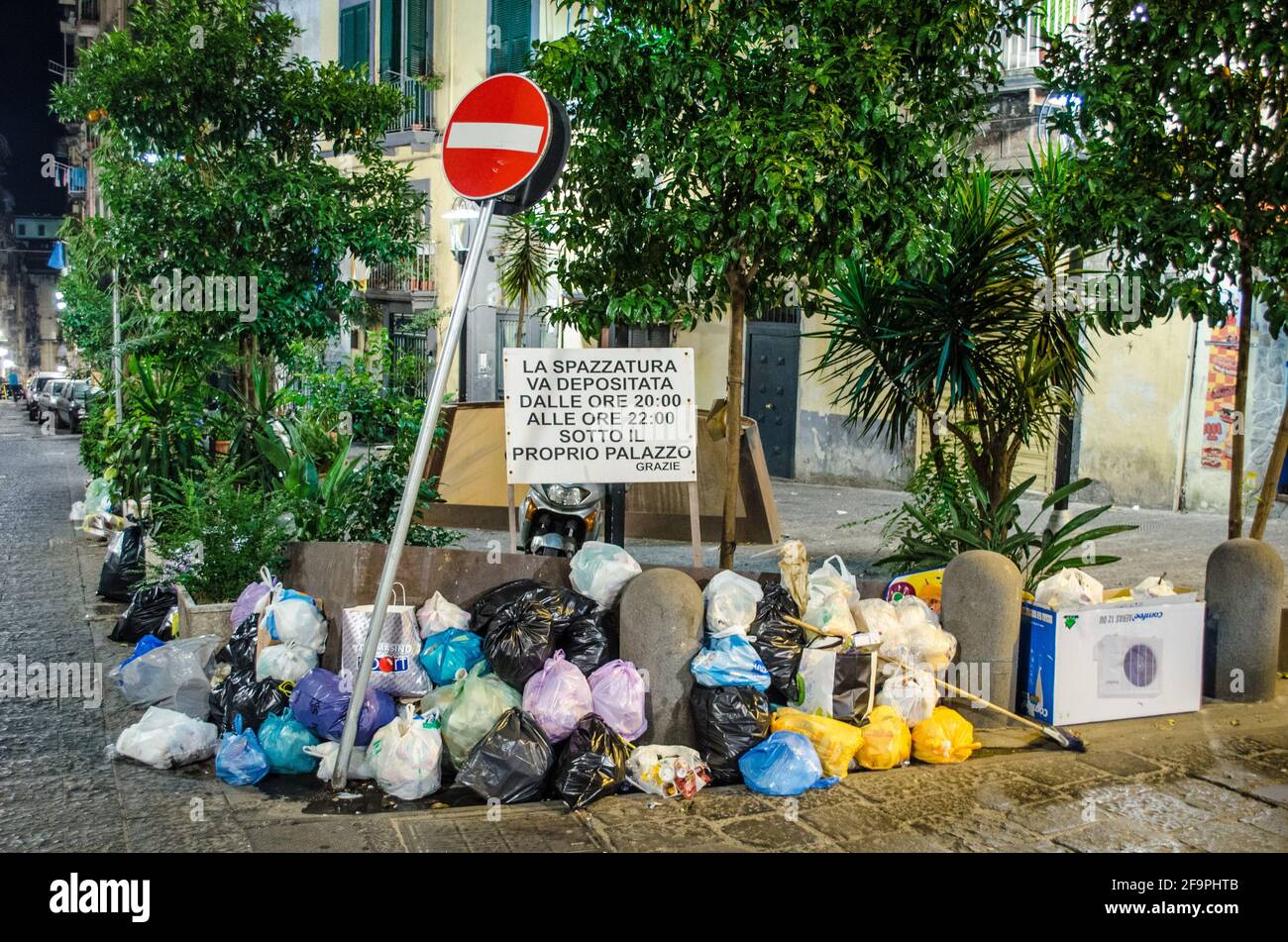 view of pile of trash situated inside of italian city naples - napoli ...