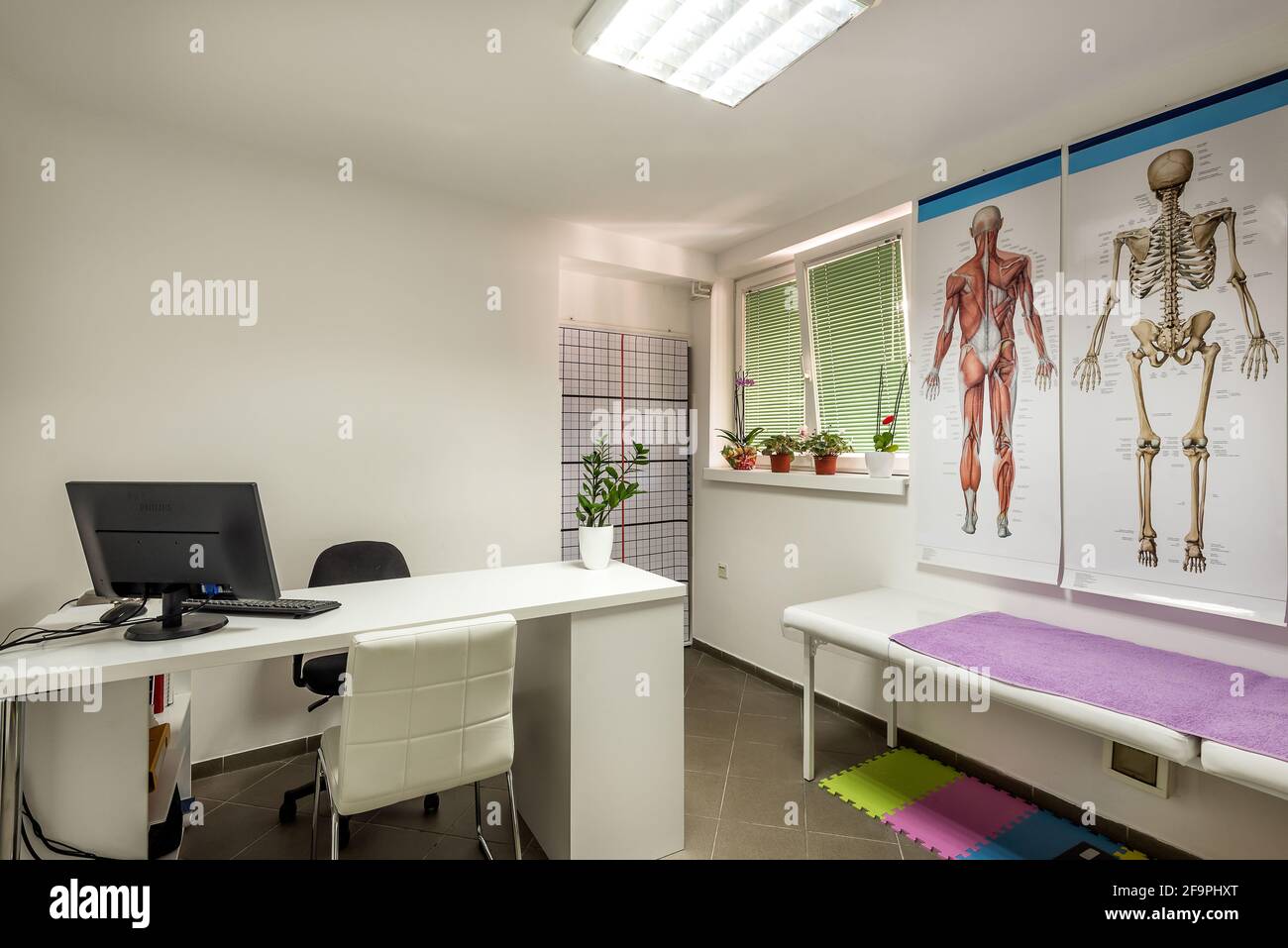 Physician Doctors Office with examination bed and therapy equipment ...