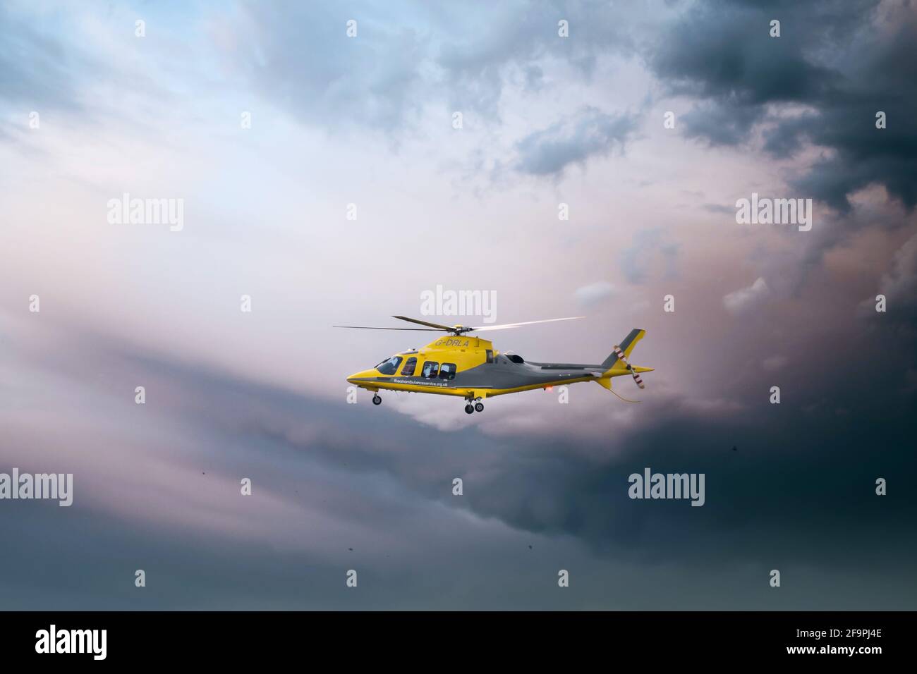 Air Ambulance helicopter yellow medical emergency chopper taking off ...
