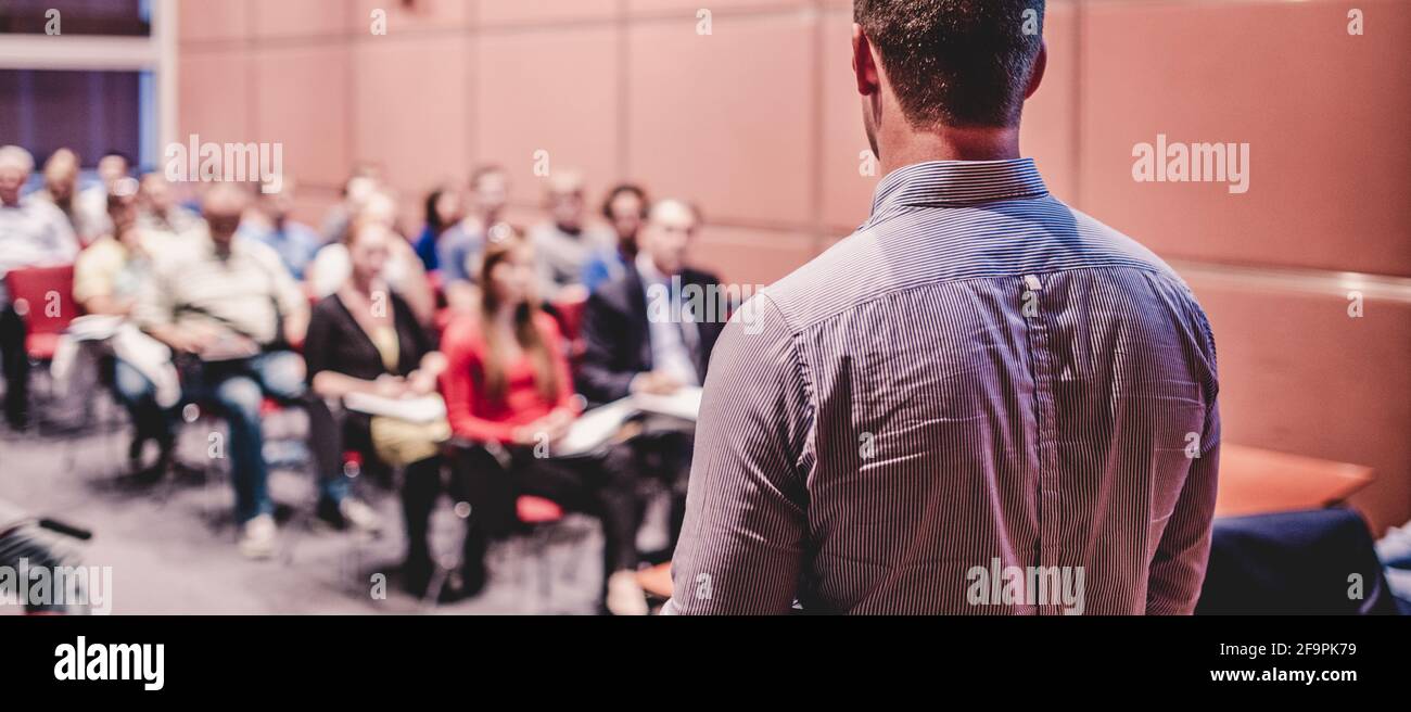 Public speaker giving talk at Business Event Stock Photo - Alamy