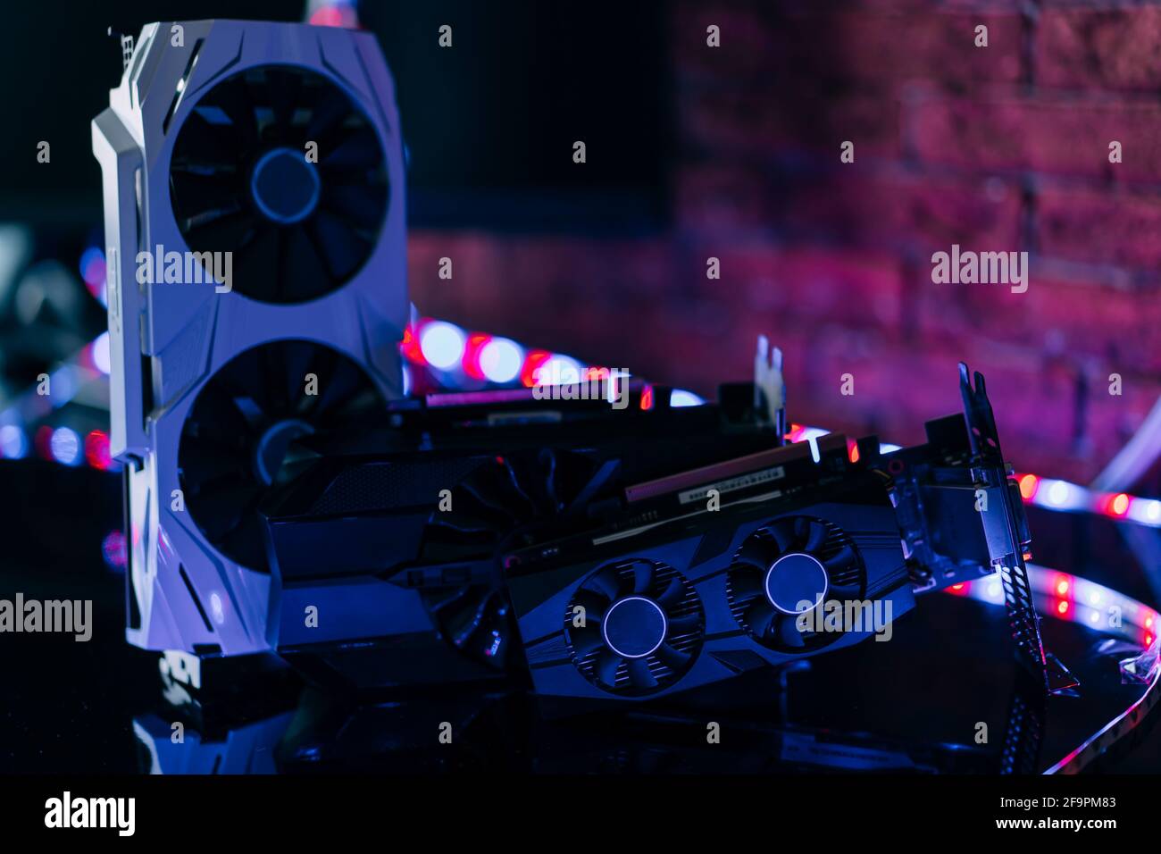 Graphics cards of different sizes and configurations on black table ...