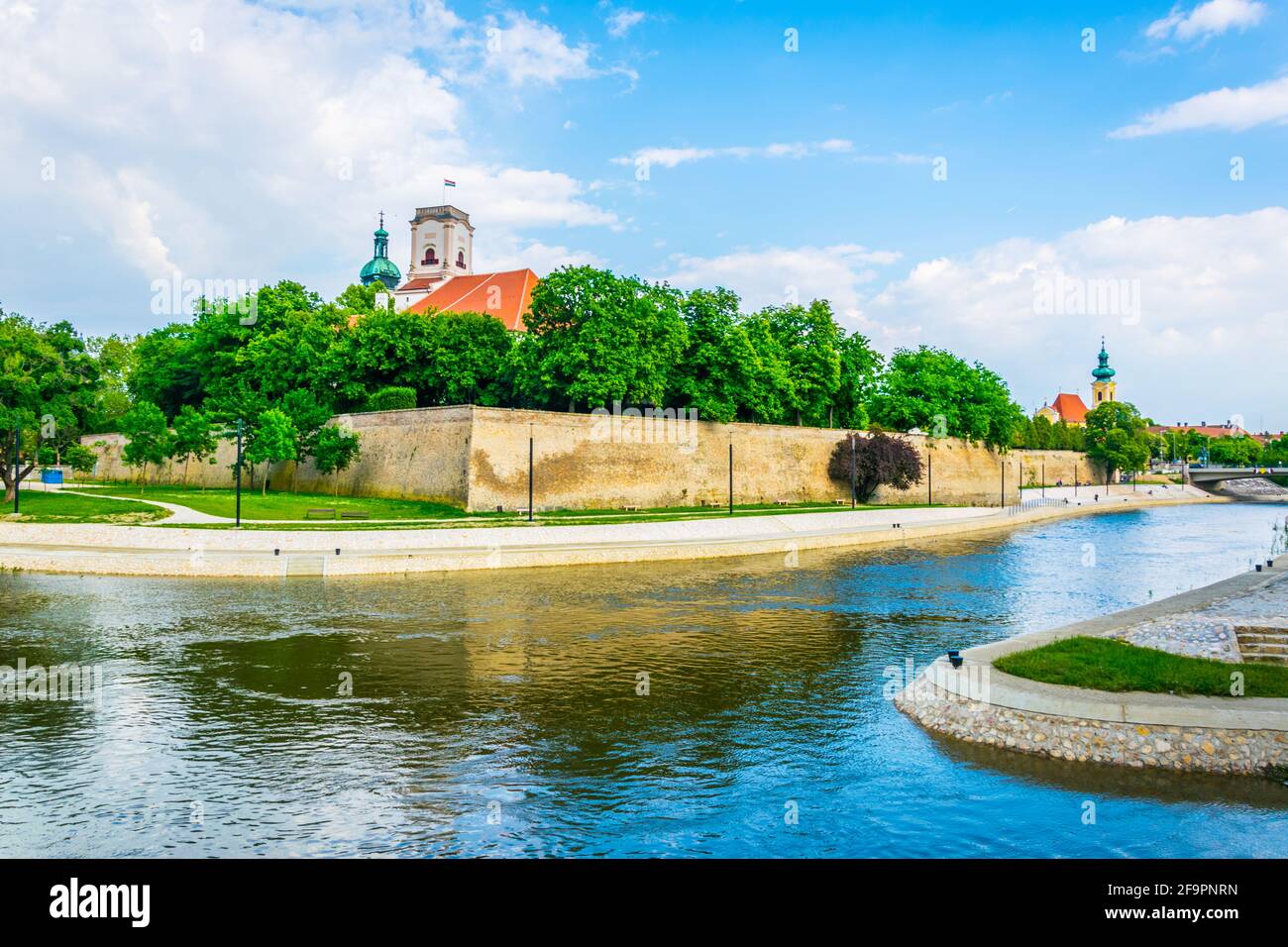 bishop castle and cathedral tower over the river in gyor city in ...