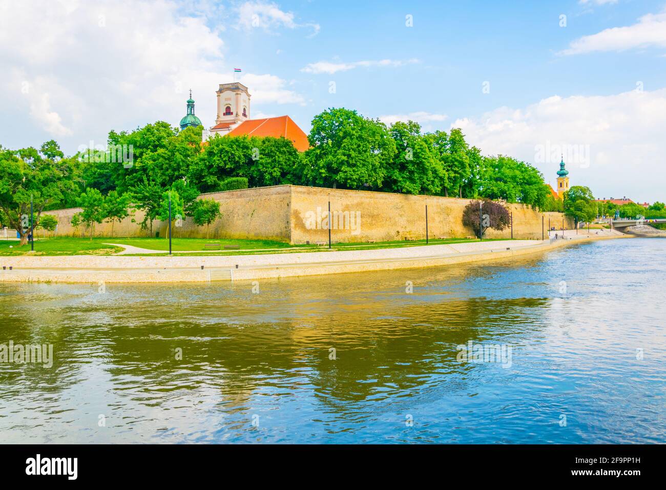 bishop castle and cathedral tower over the river in gyor city in ...
