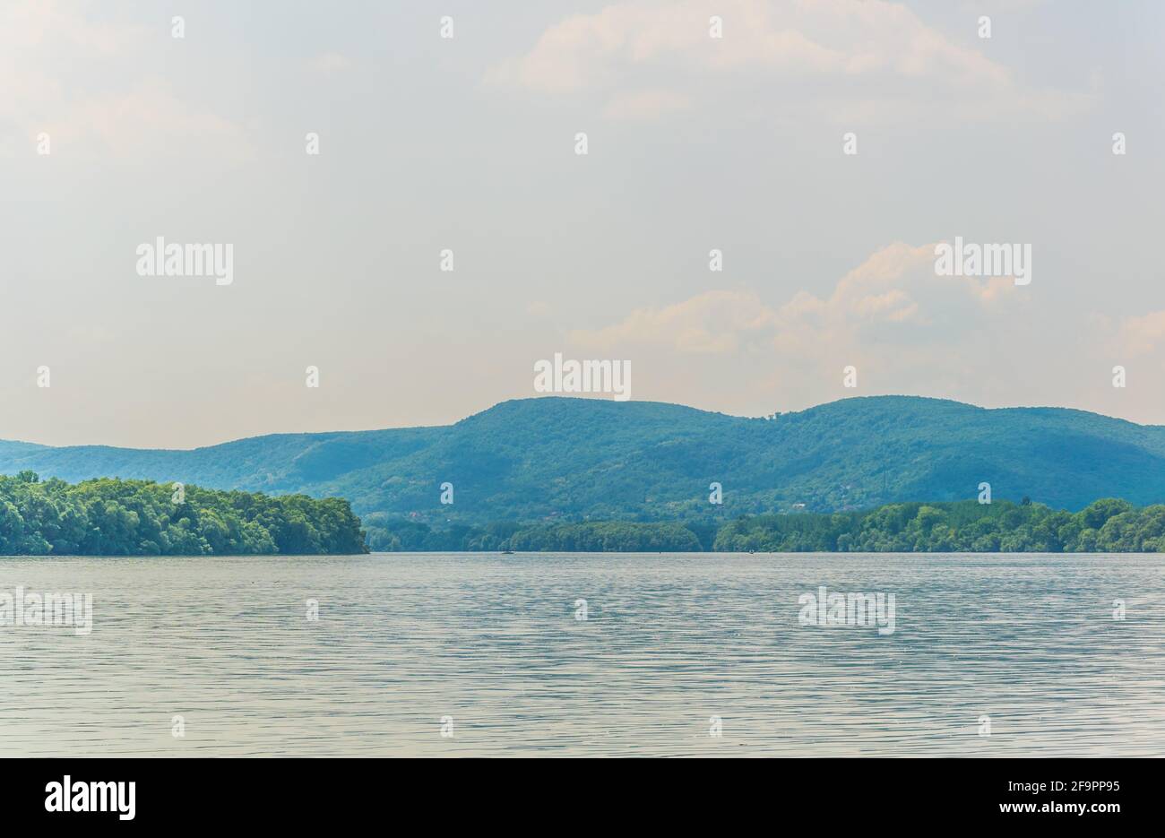 Panorama of Borzsony hills in Hungary reflecting on the danube river ...