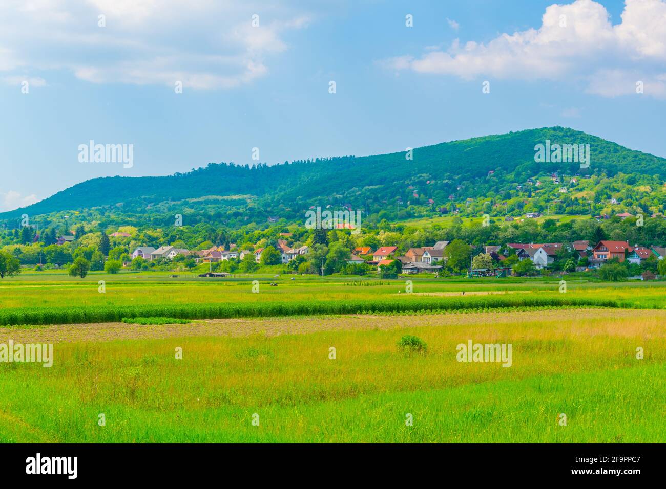 a small hungarian village nestled among fields and hills Stock Photo ...
