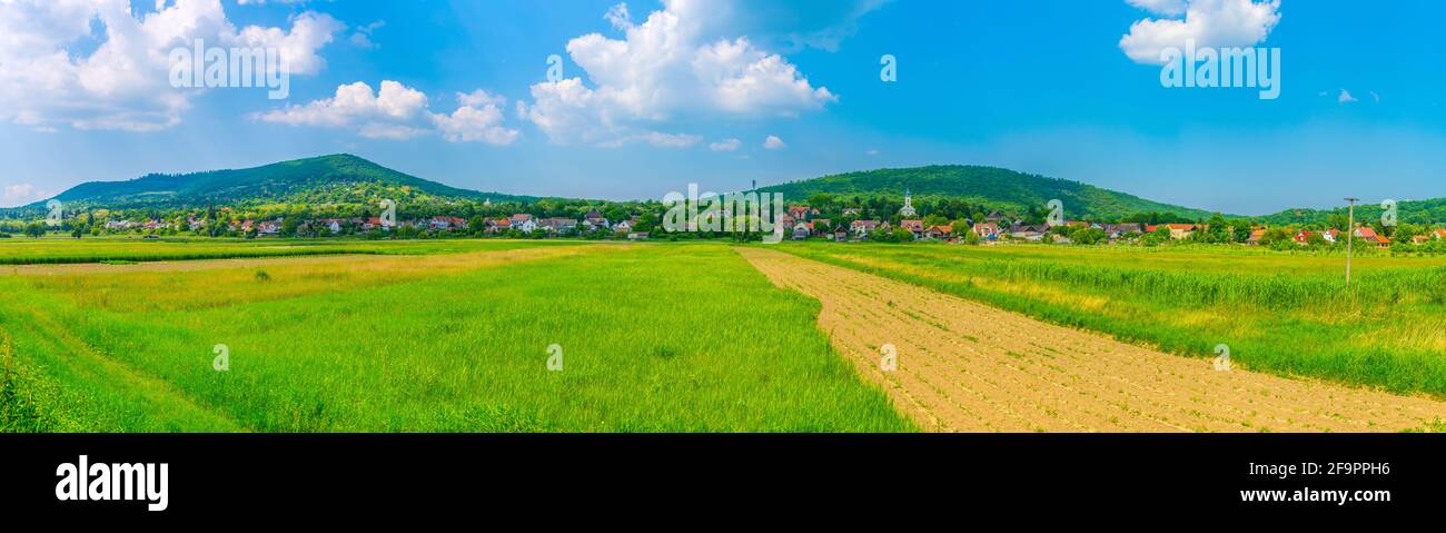 a small hungarian village nestled among fields and hills Stock Photo ...