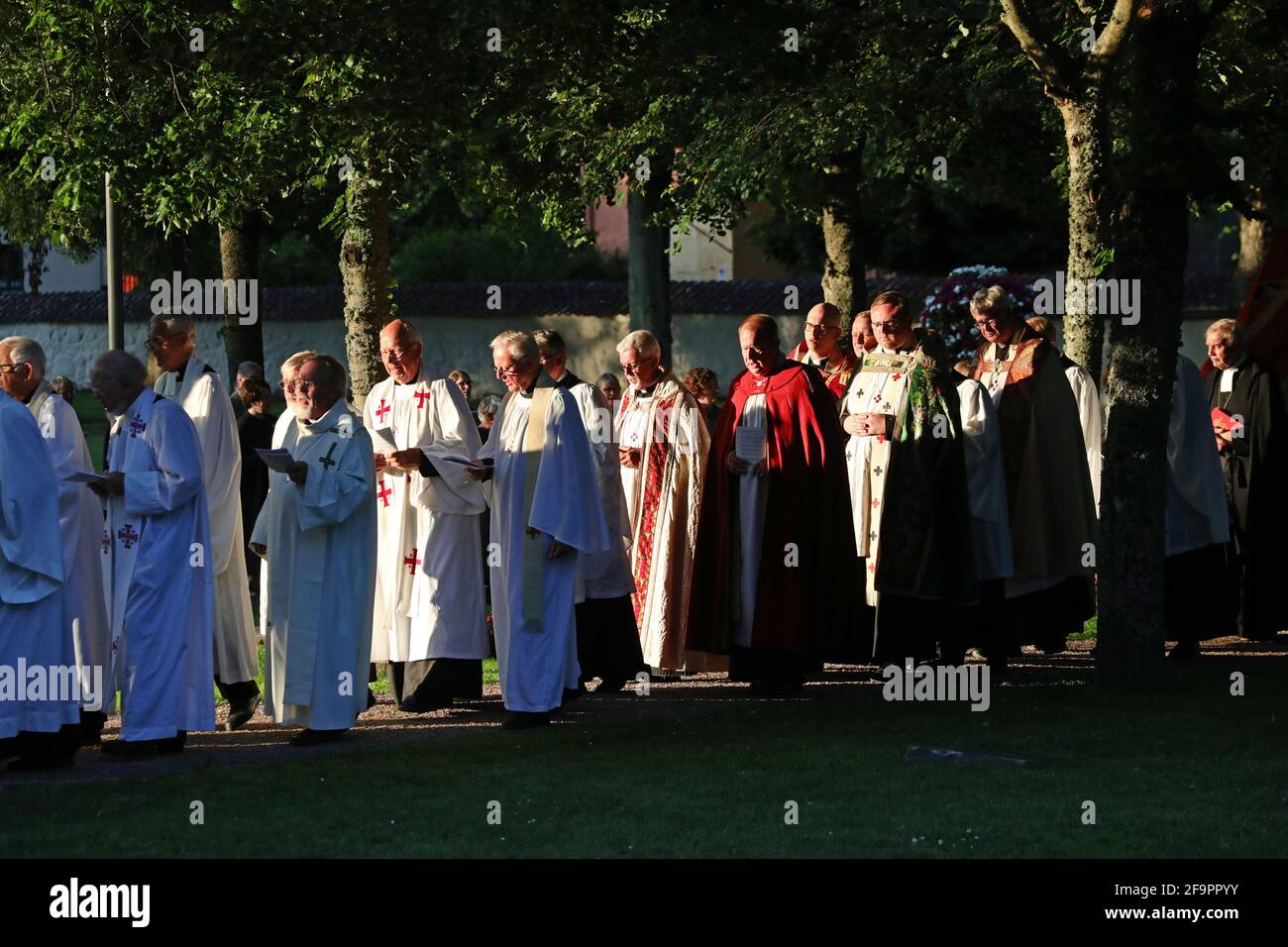 Priests outside Vadstena abbay church Stock Photo - Alamy