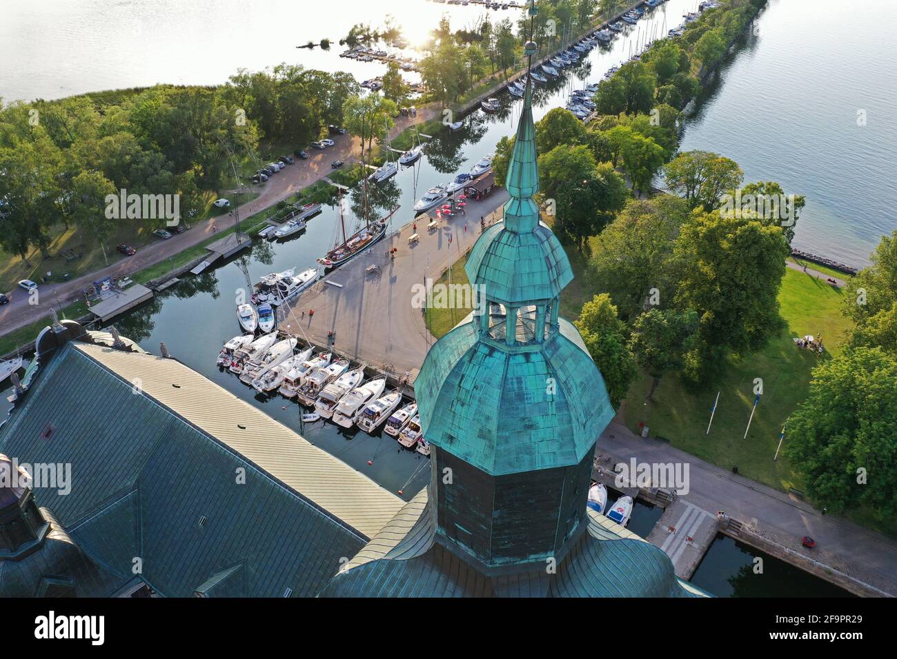 Boats and jet skis in the moat to Vadstena Castle Stock Photo - Alamy