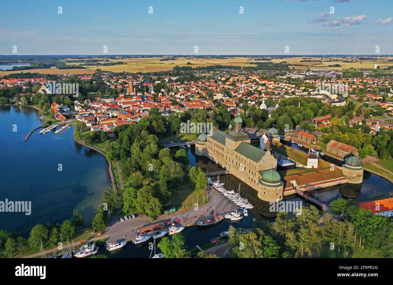 Boats and jet skis in the moat to Vadstena Castle Stock Photo - Alamy
