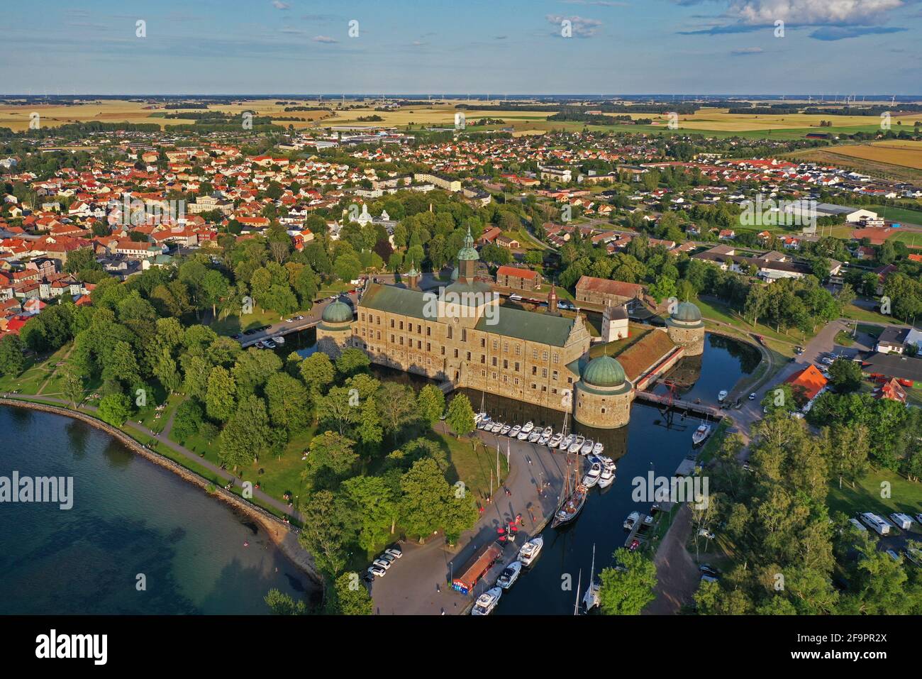 Boats and jet skis in the moat to Vadstena Castle Stock Photo - Alamy