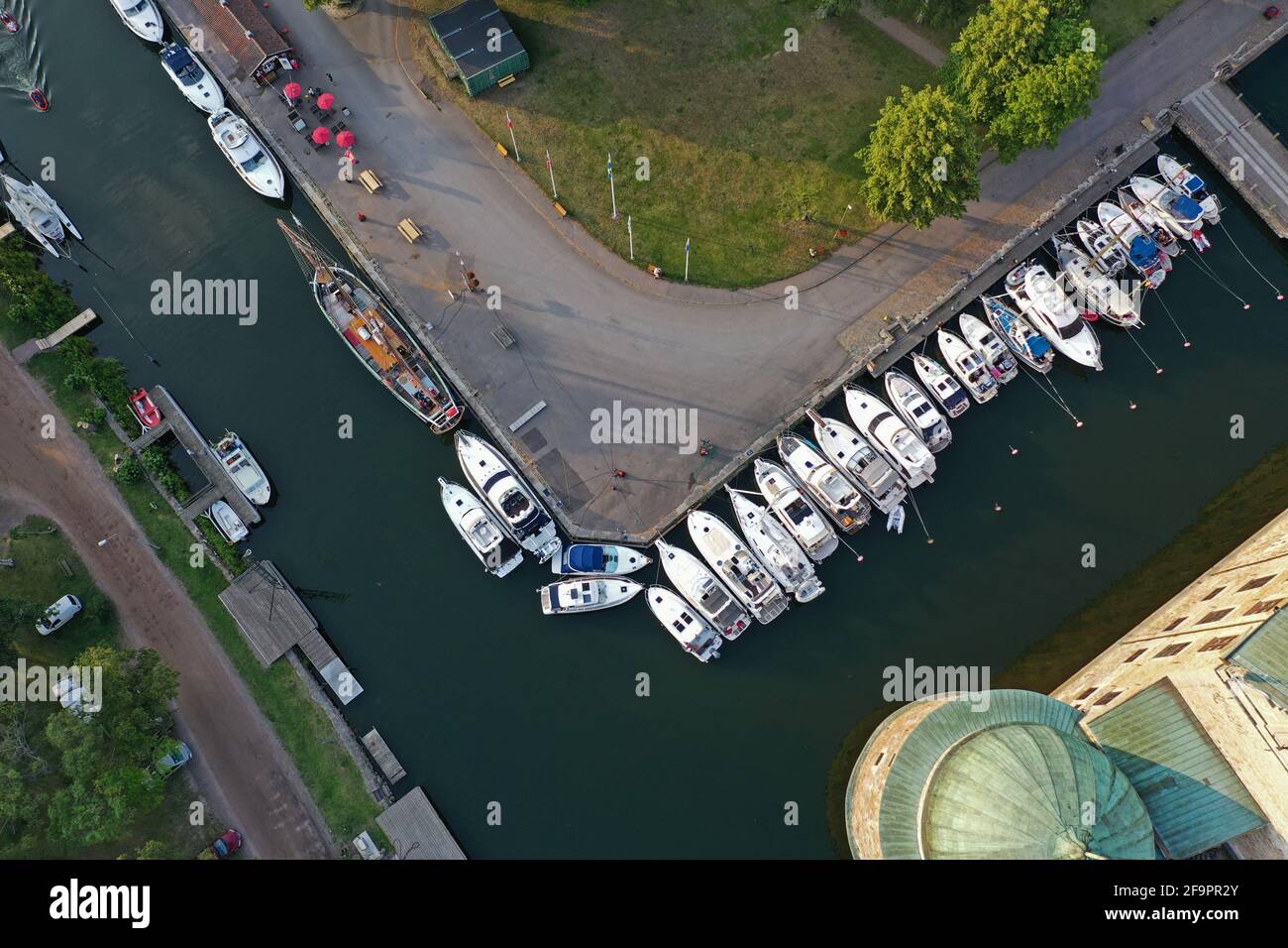Boats and jet skis in the moat to Vadstena Castle Stock Photo - Alamy