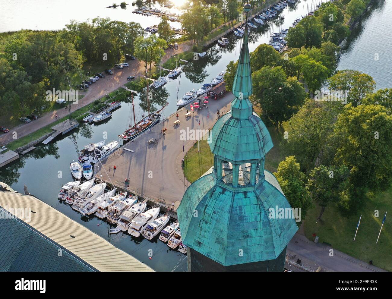 Boats and jet skis in the moat to Vadstena Castle Stock Photo - Alamy