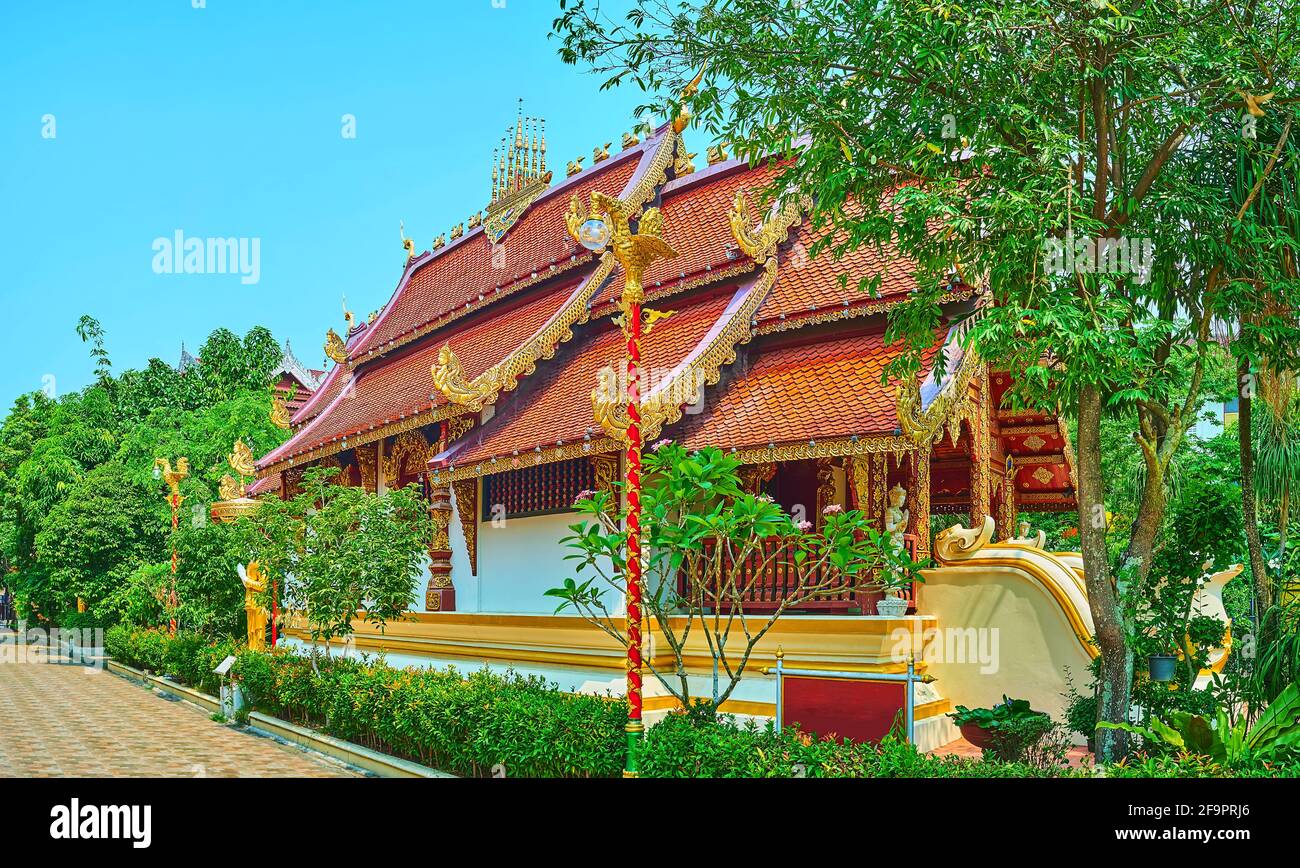 The gable roof (pyathat) of the Wat Phra Singh Viharn Hall with carved ...