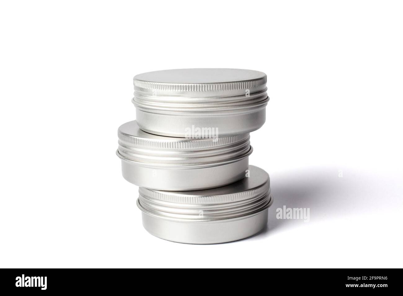 Three metal jar of cream isolated on white background. Aluminum pot for ...