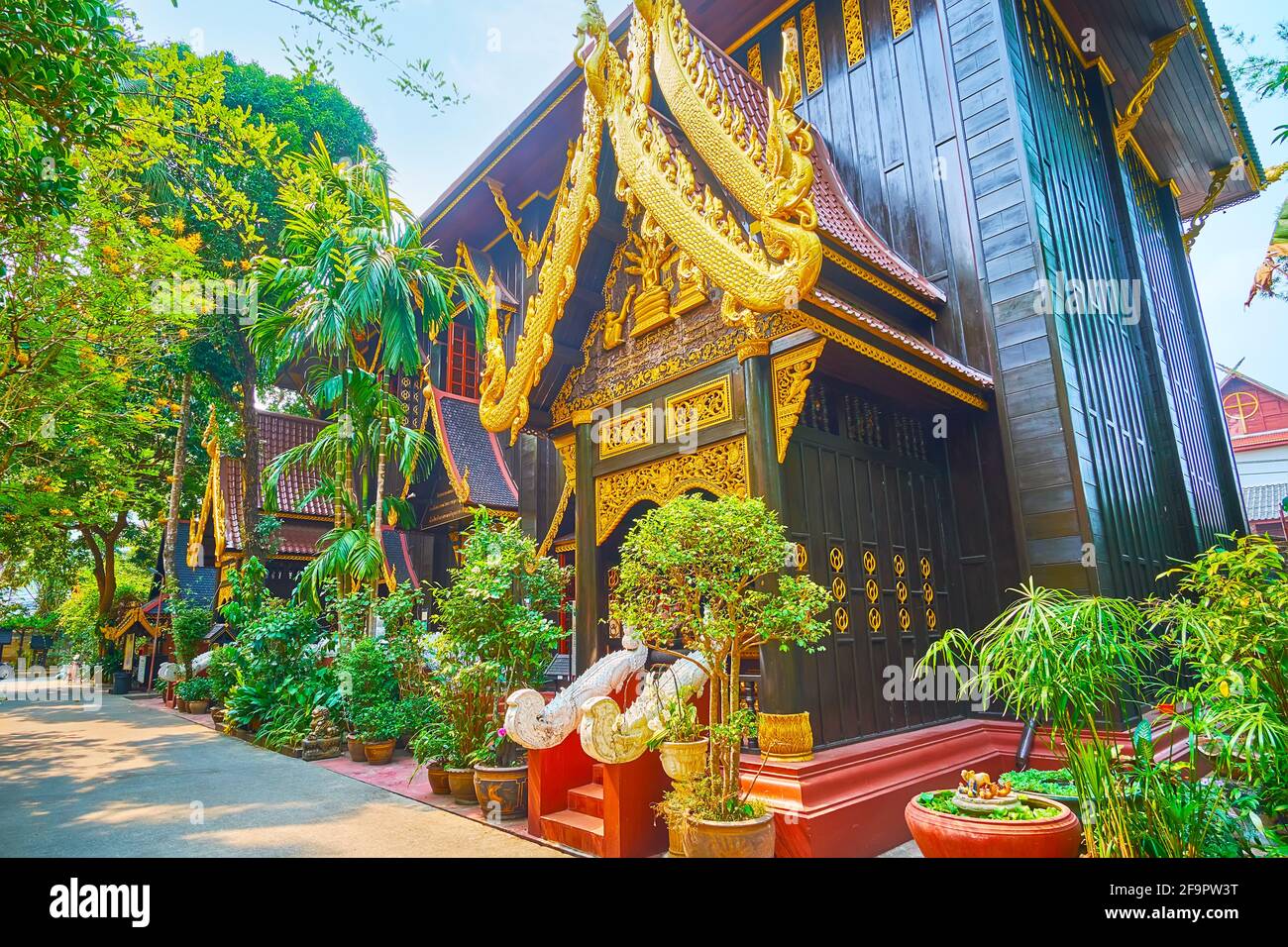 The scenic wooden building of Museum of Wat Phra Kaew Temple, decorated ...