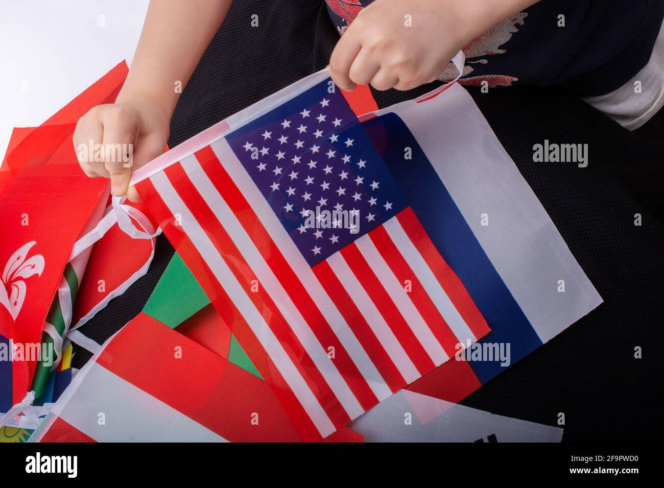 Child hand holding an American national flag in hand Stock Photo - Alamy