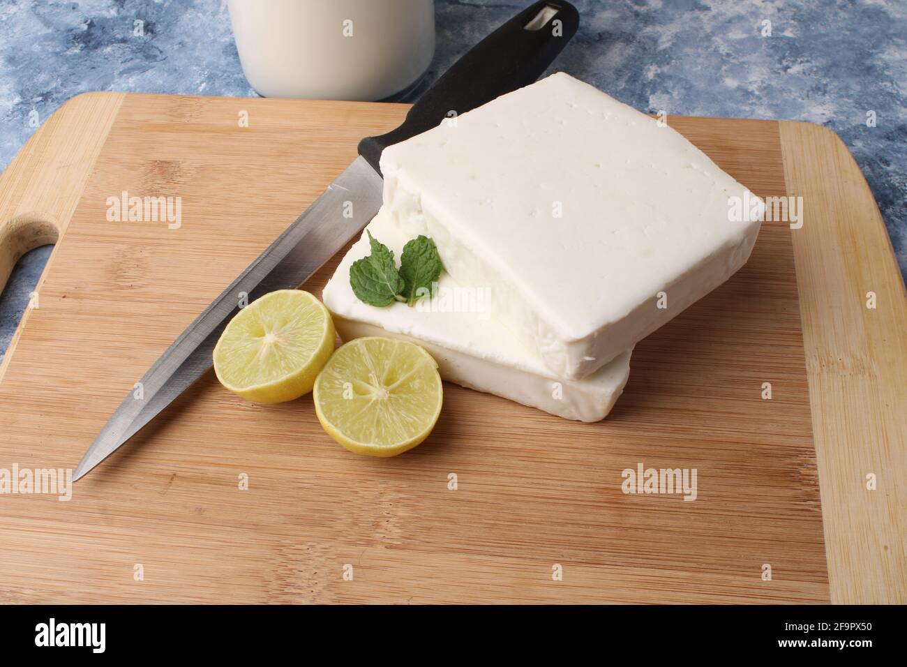 paneer making recipe ingredients, milk and lemon with fresh cottage ...