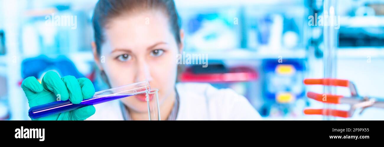 Young woman in a pharmacological laboratory. Antiallergic drug ...